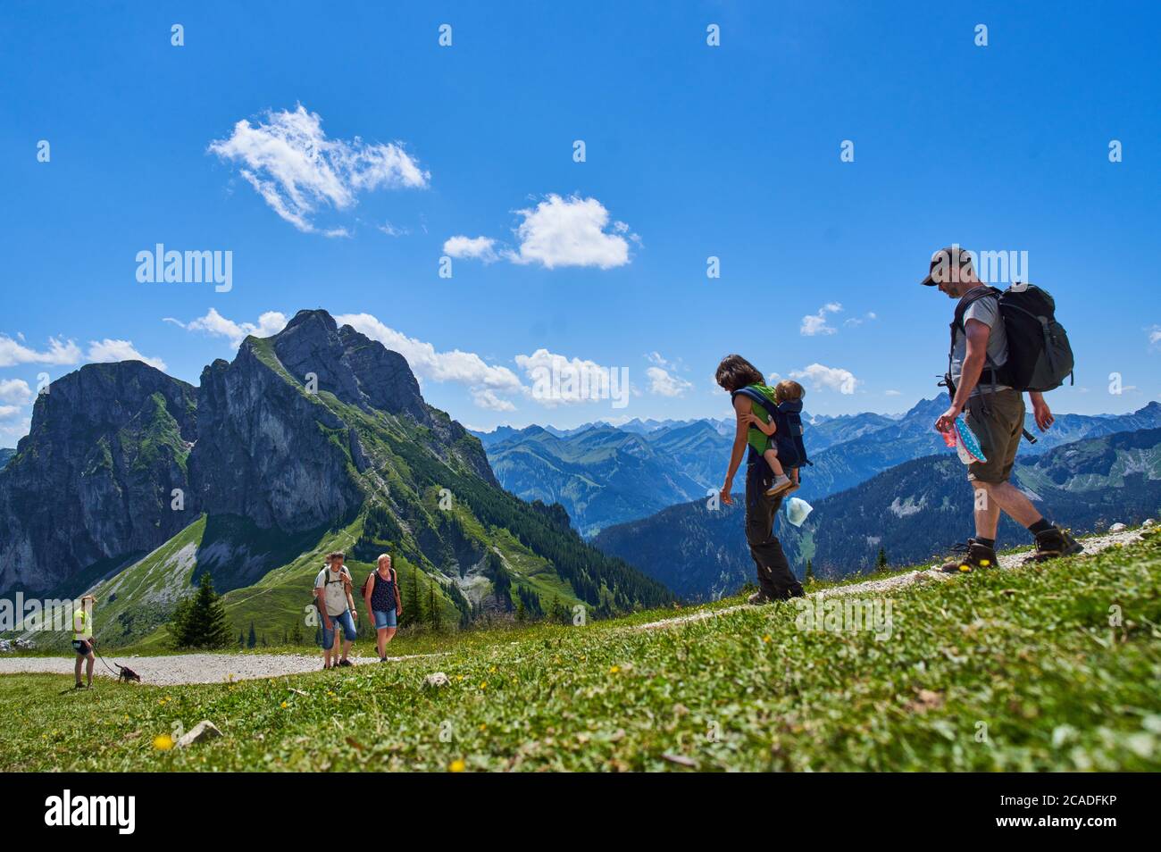 Pfronten, Germany, 28th July 2020, Hiker, mountain biker and paraglider ...