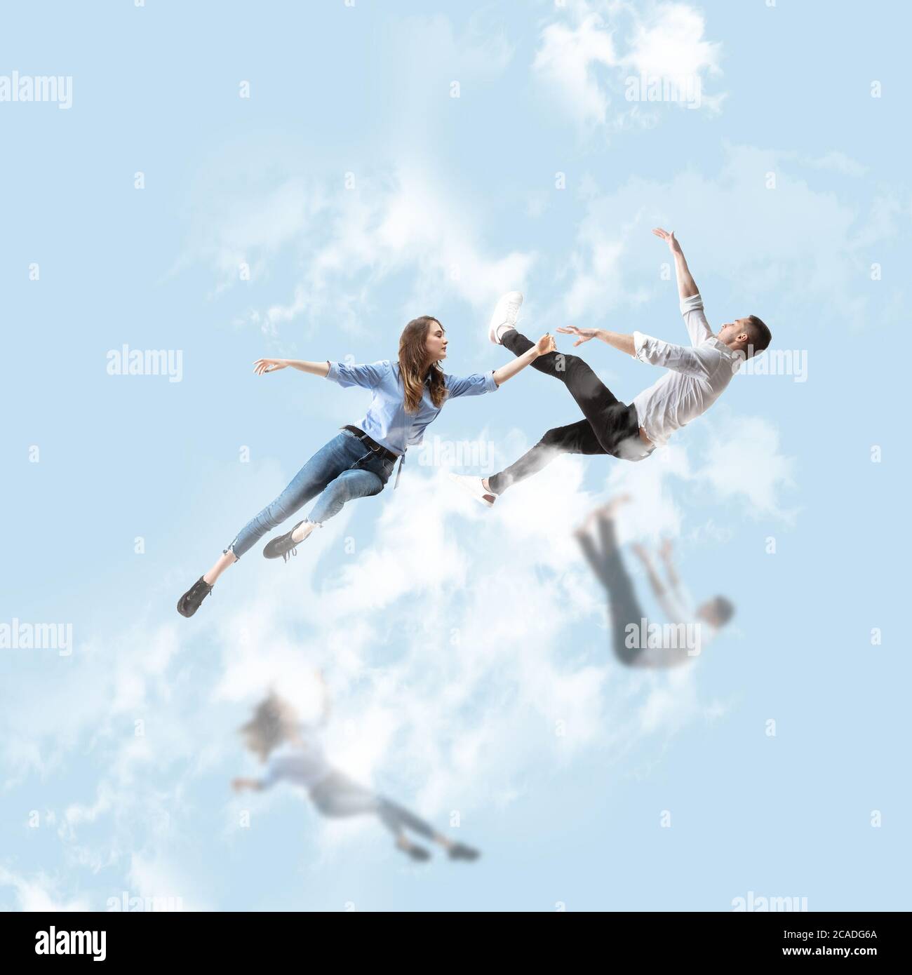 Mid-air beauty cought in sky. Full length shot of attractive young ...