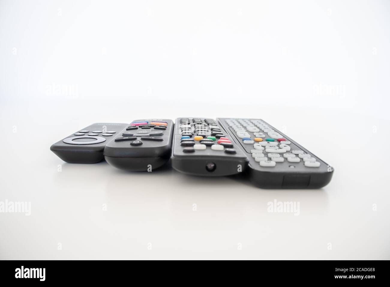 On a white background the remote controls, one for each device used ...