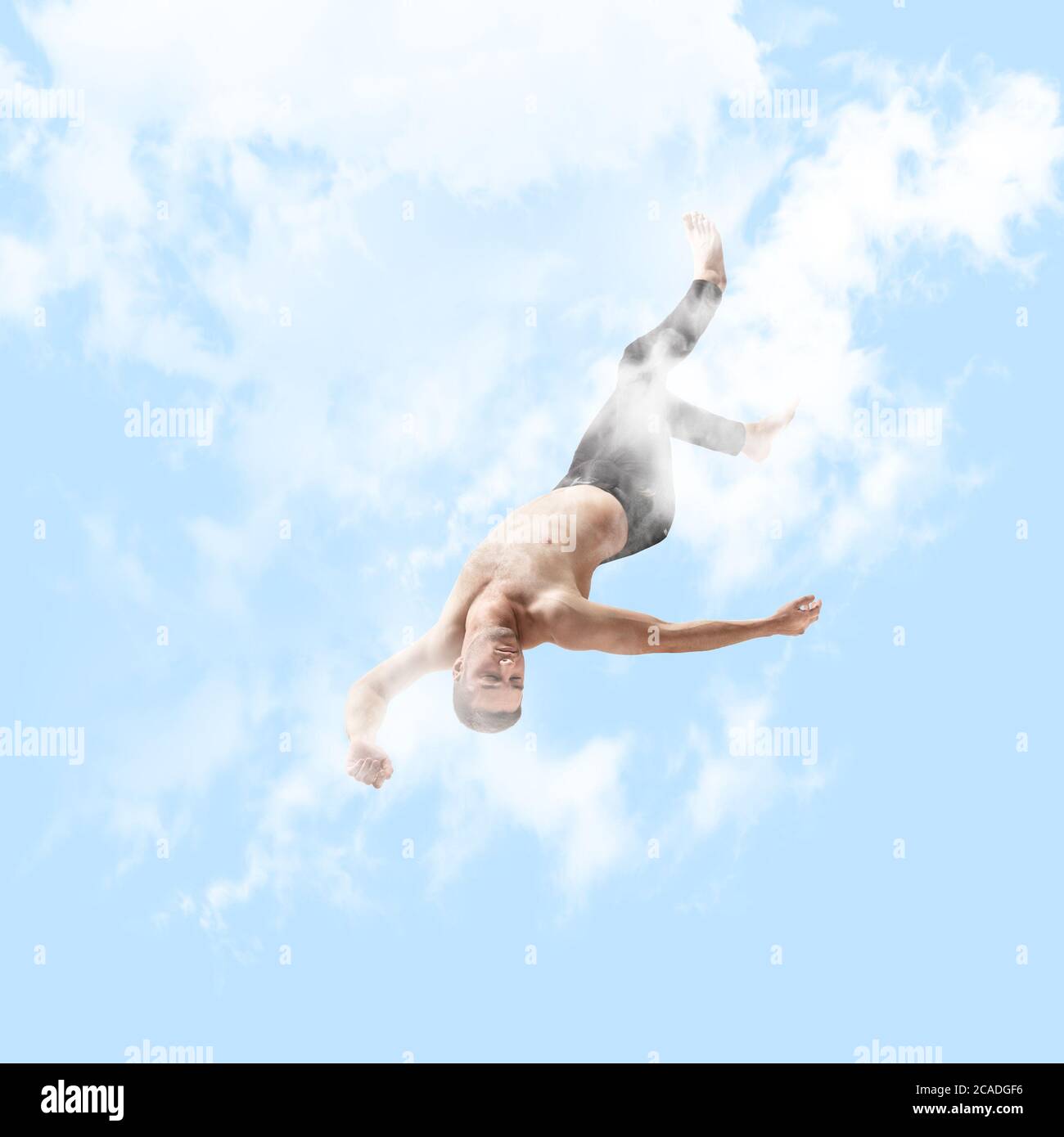 Mid-air beauty cought in sky. Full length shot of young man hovering in ...
