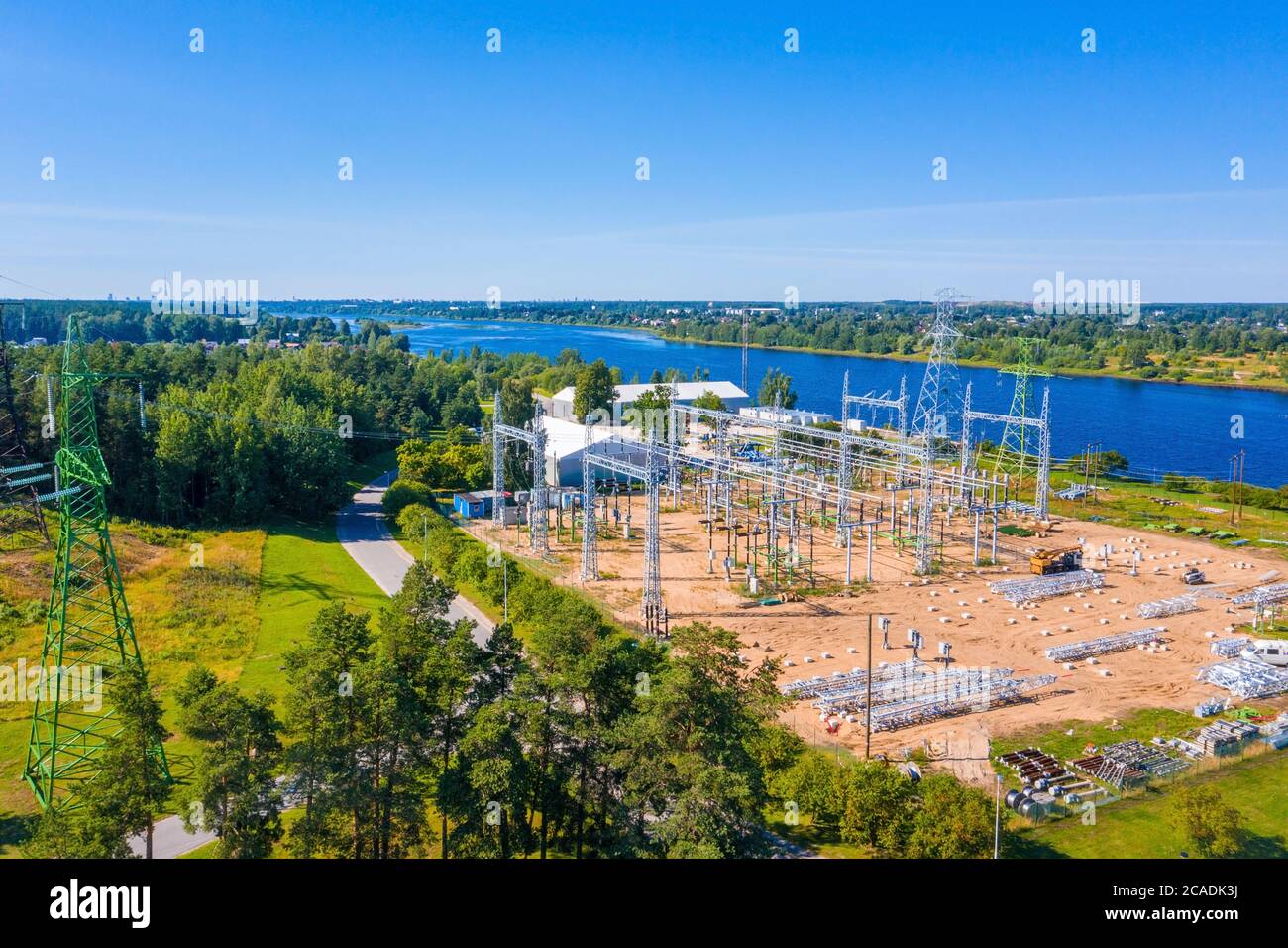 Aerial shot of electric towers powered by the Riga Hydroelectric Power ...