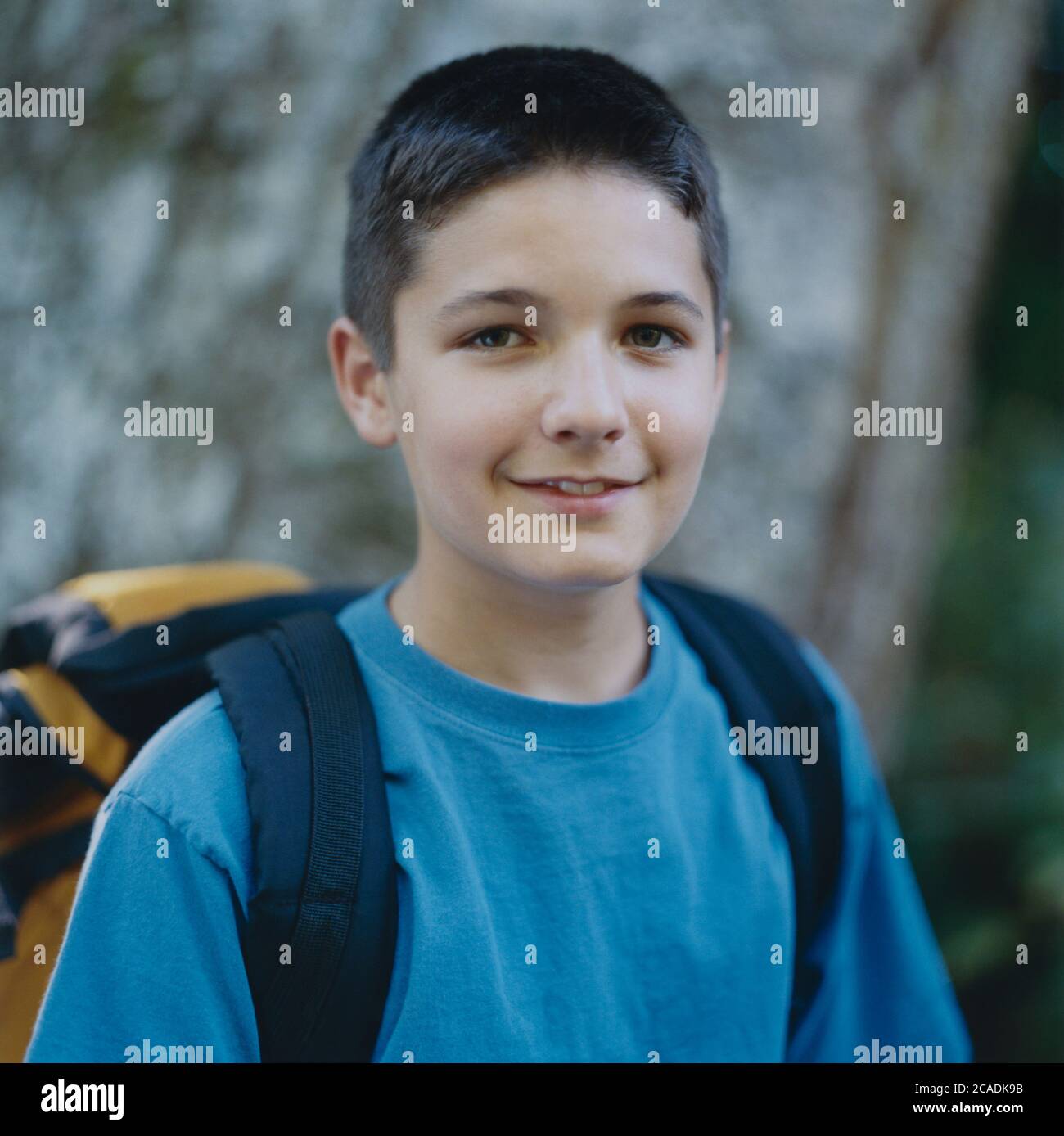 Portrait of happy adolescent boy wearing backpack Stock Photo - Alamy