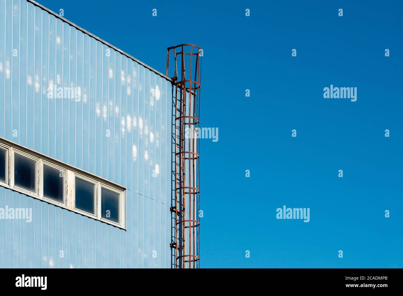 Fire ladder on an industry building upstairs Stock Photo - Alamy