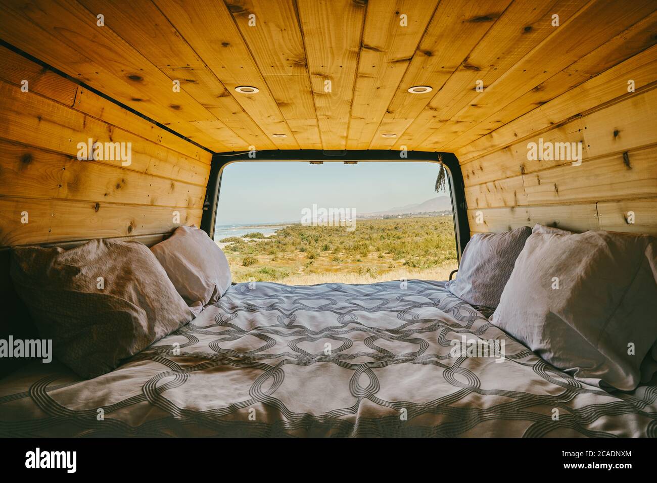 Scenic view of pacific ocean over cliffs from bed of a sprinter van in ...