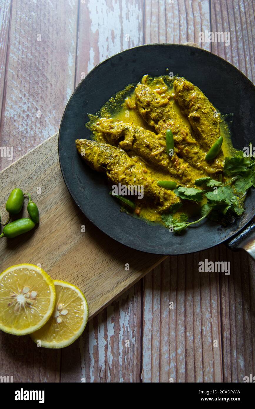 Fish in mustard sauce on a platter Stock Photo - Alamy
