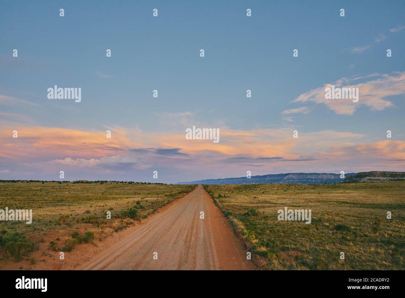 Open dirt road in Escalante, Utah during a summer roadtrip Stock Photo ...
