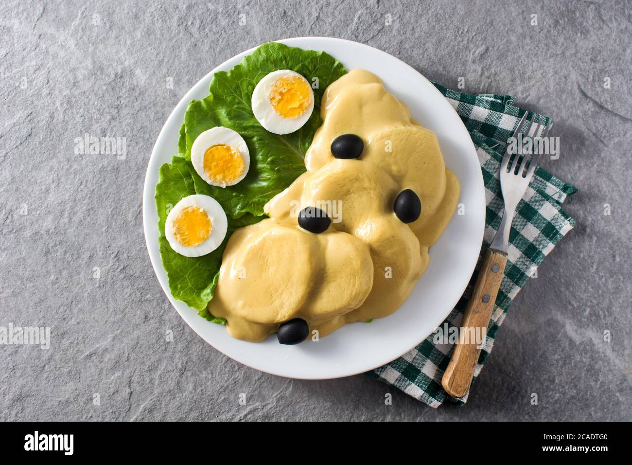 Traditional Peruvian papa a la huancaina on gray stone background Stock ...