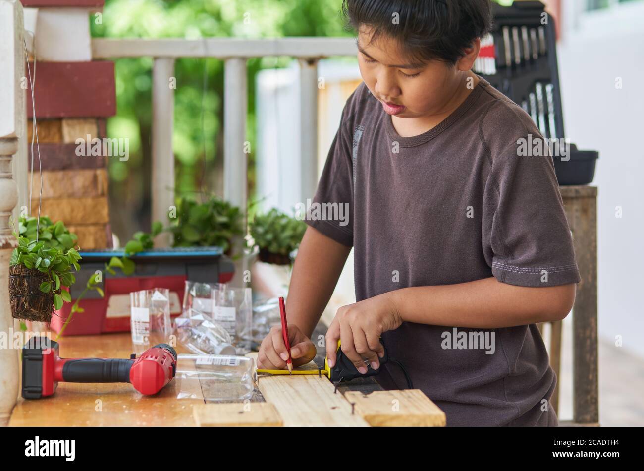 Child using tape hi-res stock photography and images - Alamy