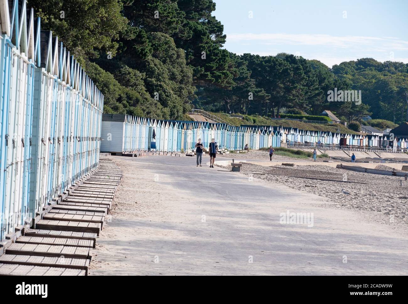A row of multicoloured beach huts at Avon Beach, Mudeford, nr ...