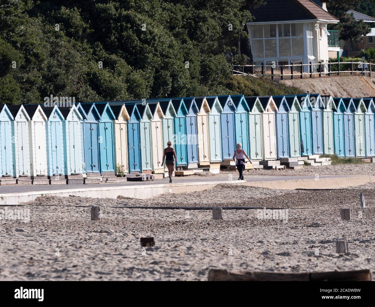A row of multicoloured beach huts at Avon Beach, Mudeford, nr ...