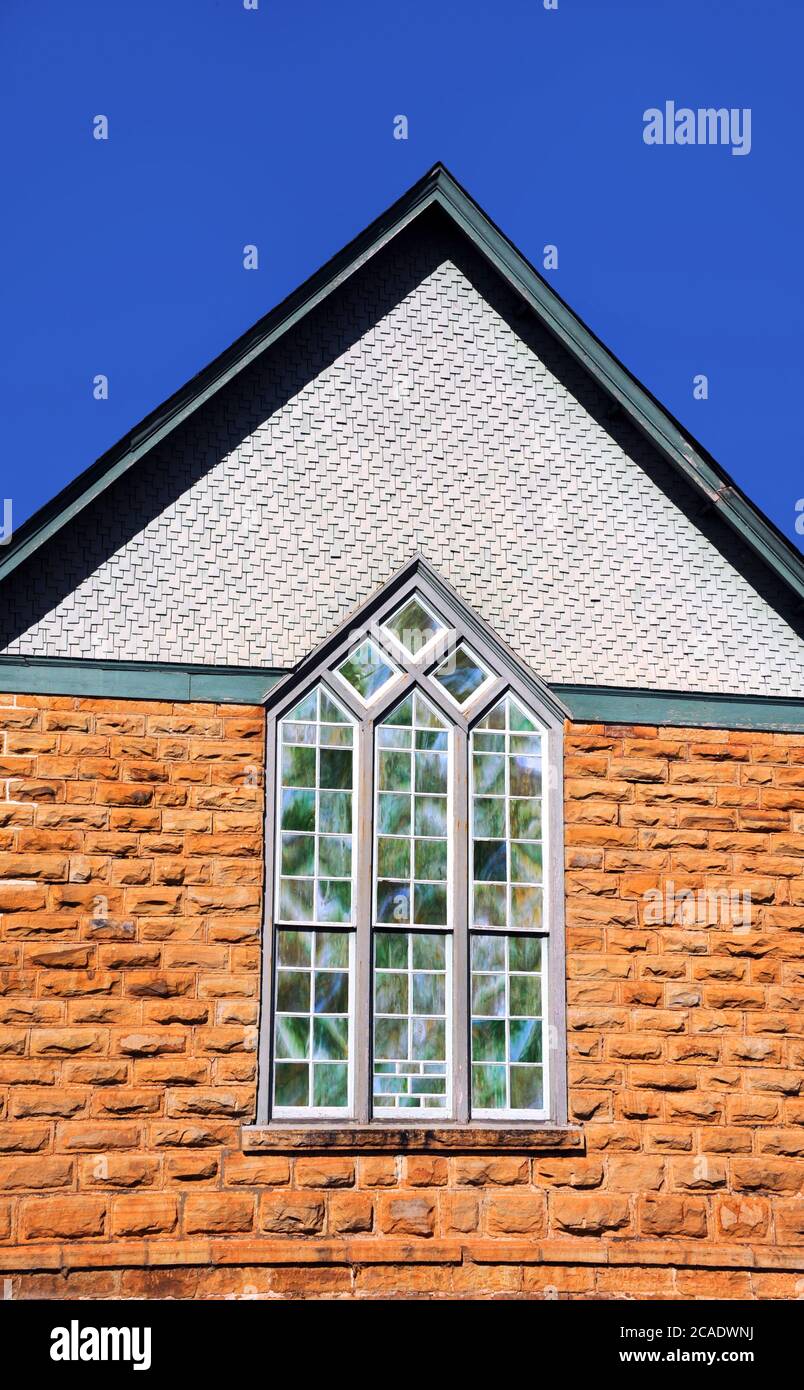 Shaker style eave meets up with a beautiful stained glass window, on ...