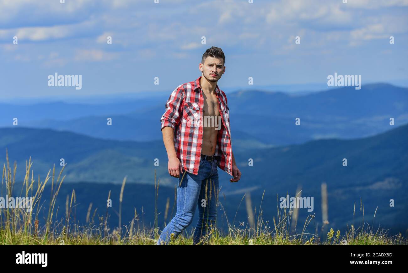 Strong hiker muscular torso. Athlete muscular guy relax mountains ...