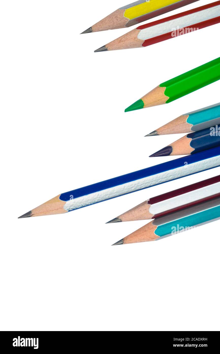 Few different colored wood pencil crayons placed on top of a white ...
