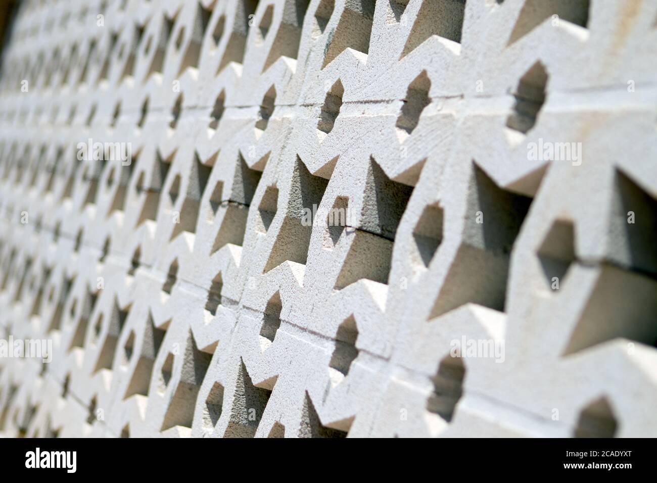 White wall made from patterned concrete blocks Stock Photo - Alamy