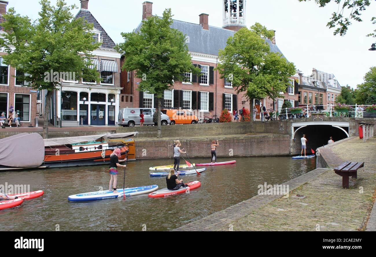 DOKKUM, NETHERLANDS, 22 JULY 2020: Tourists exploring the waterways of ...