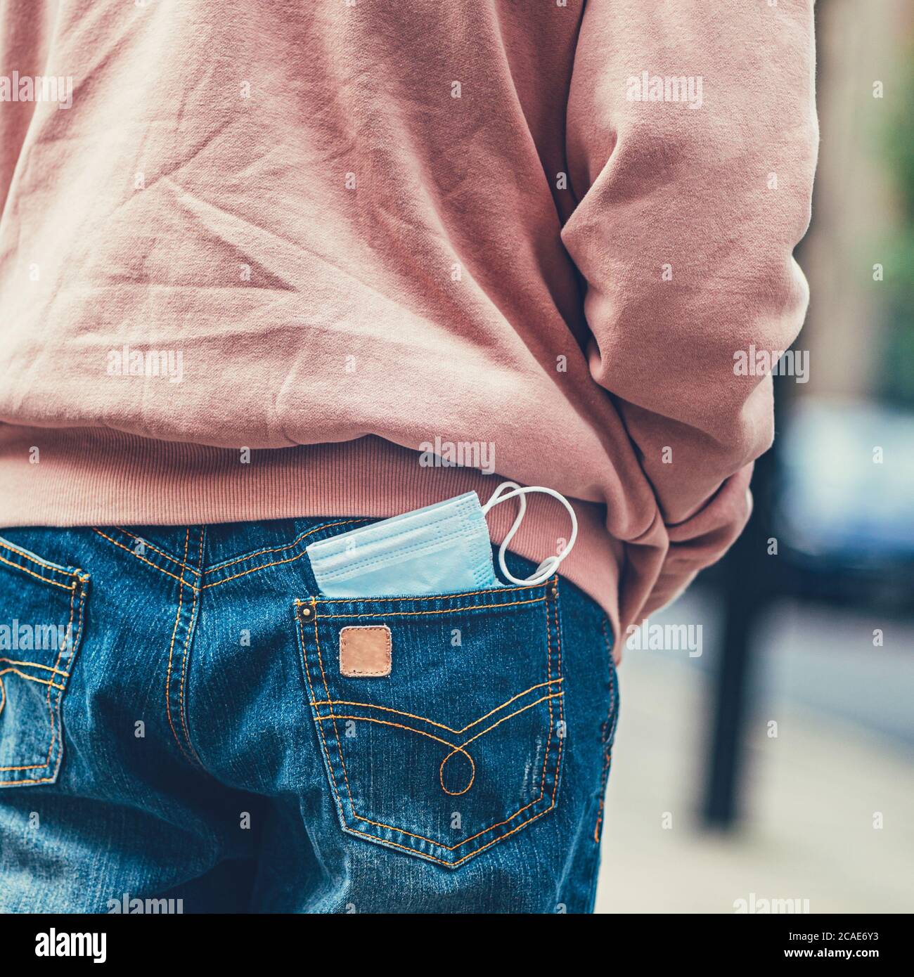 Medical mask in jeans pocket hi-res stock photography and images - Alamy