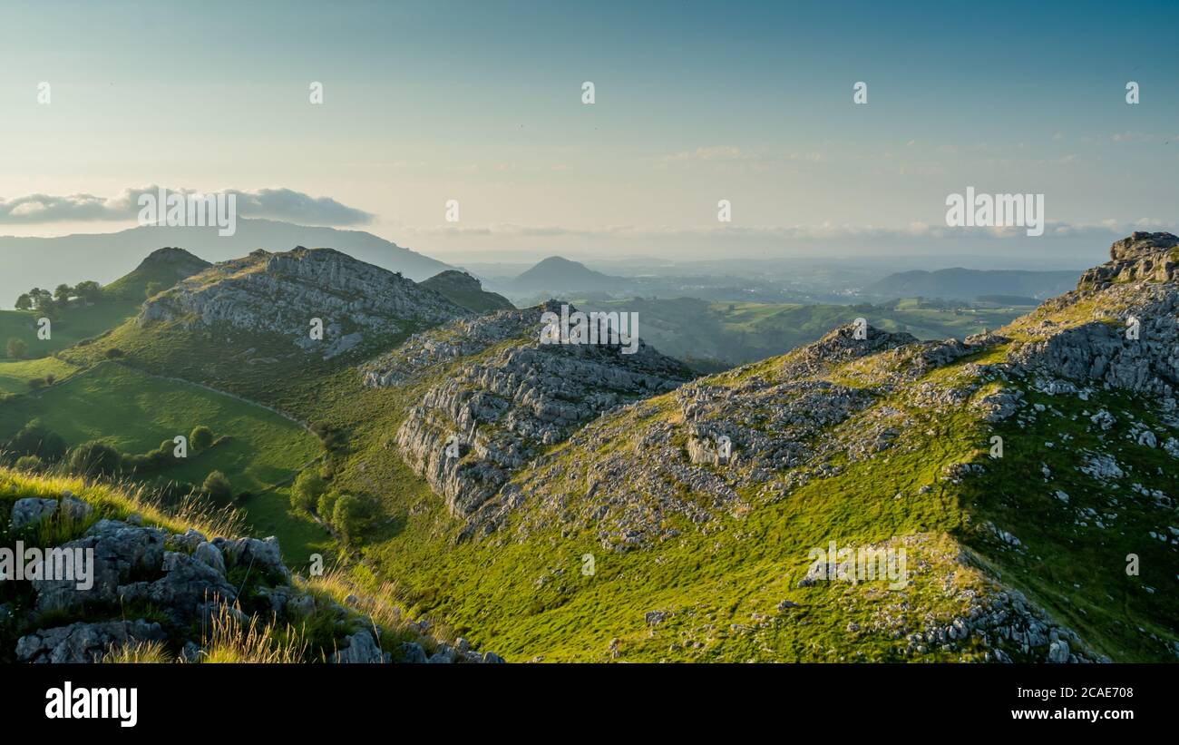 Beautiful shot of tree-covered hills and cliffs on a bright day Stock ...