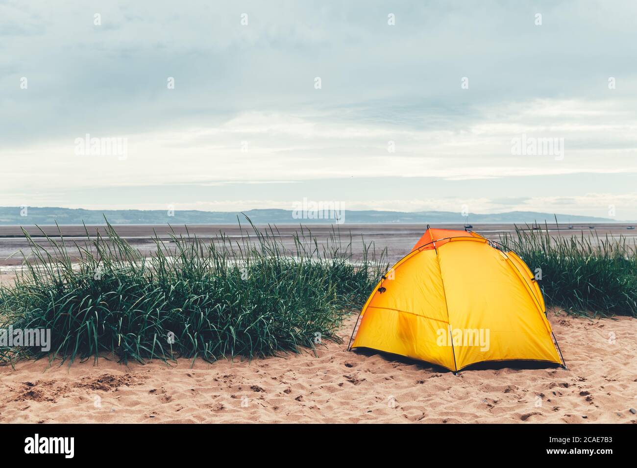 Bright Yellow Tent on the Beach Stock Photo - Alamy
