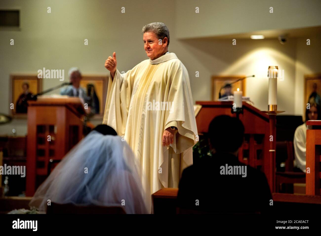 Catholic priest sings at wedding | Beachweddingtips.com