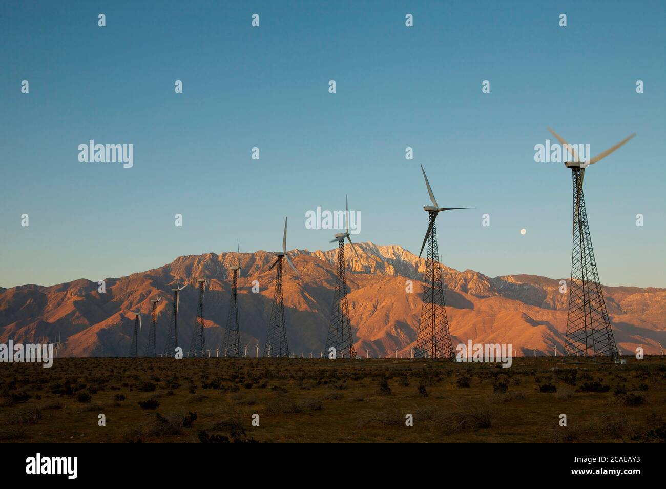 various windmills in a valley at the base of a mountain Stock Photo - Alamy