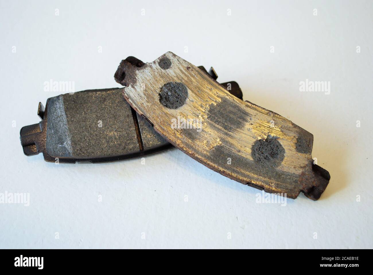 Worn out ruined disc brake pad compared to one that is new Stock Photo ...