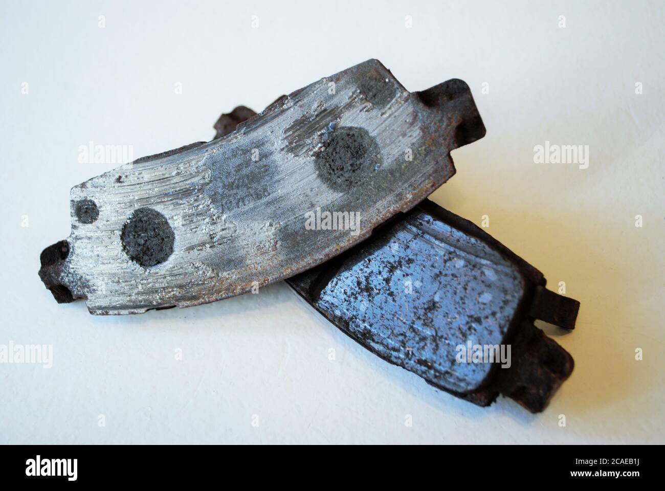 pair of worn out ruined disc brake pads Stock Photo - Alamy
