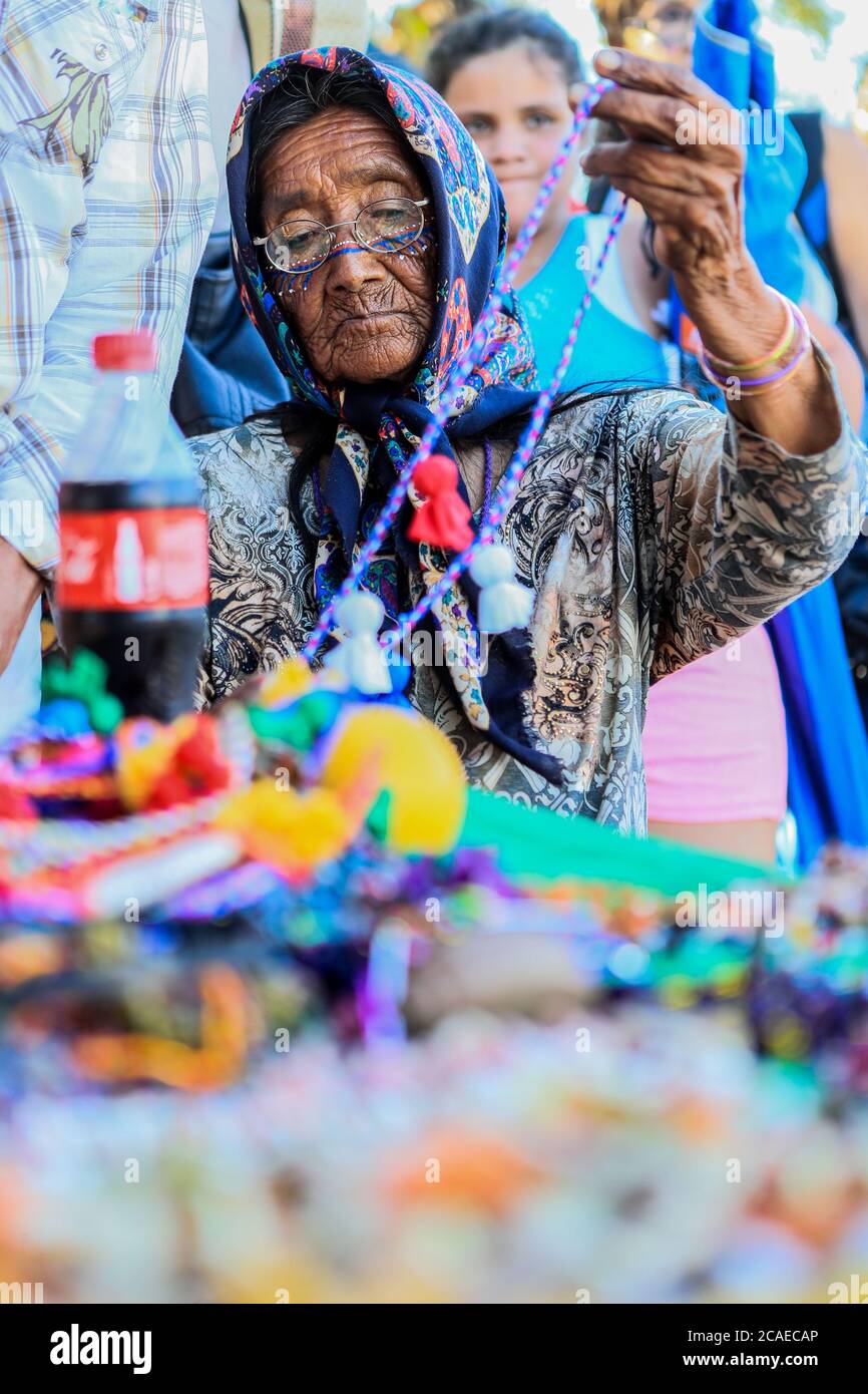 An elderly Seri woman performs traditional and ancestral songs during ...