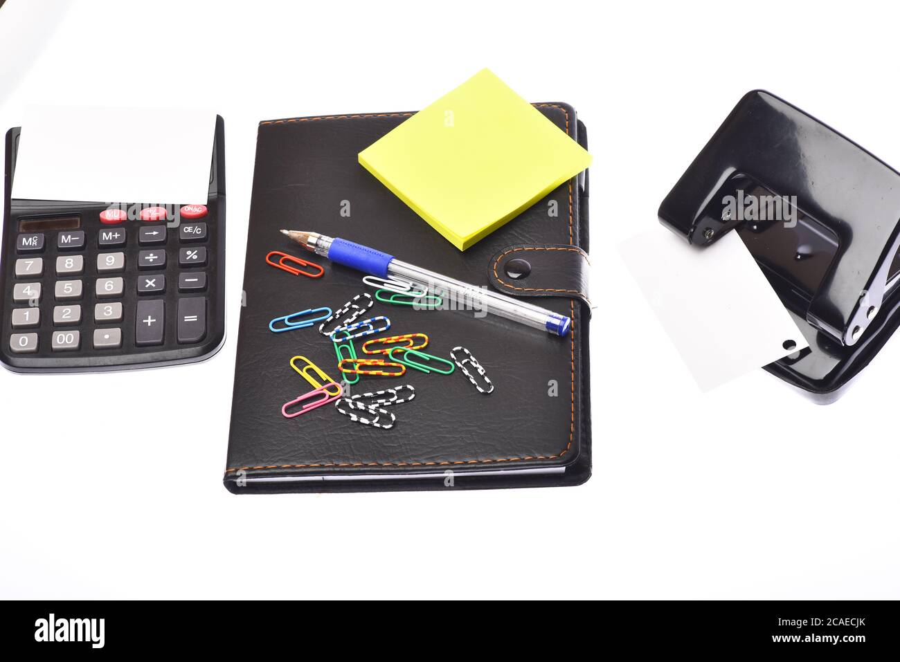 Leather covered notebook, hole punch, note paper, pen and clips ...