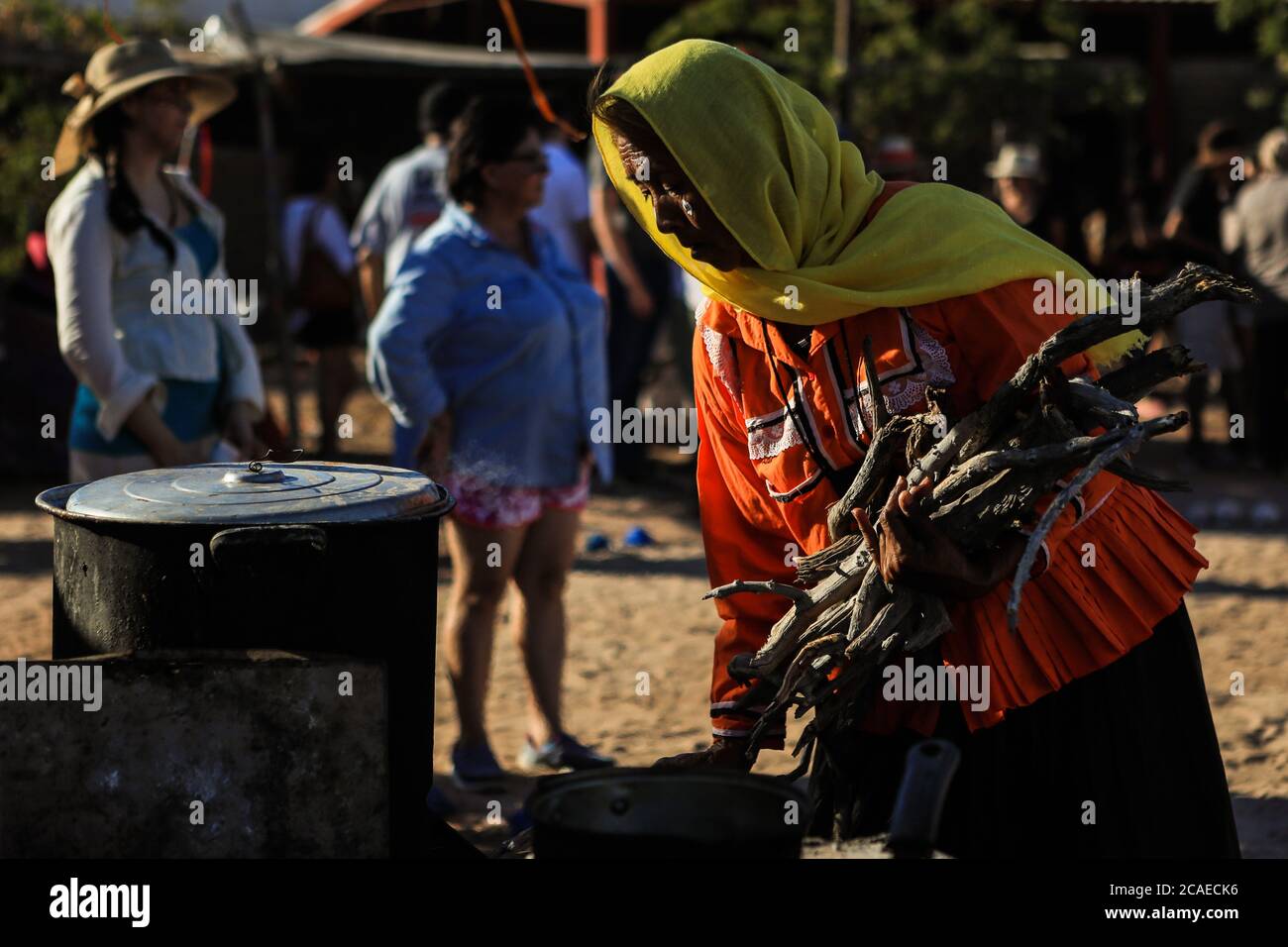 A Seri woman will provide food with firewood during the Seri New Year ...