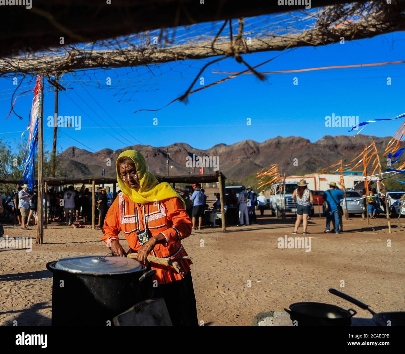A Seri woman will provide food with firewood during the Seri New Year ...