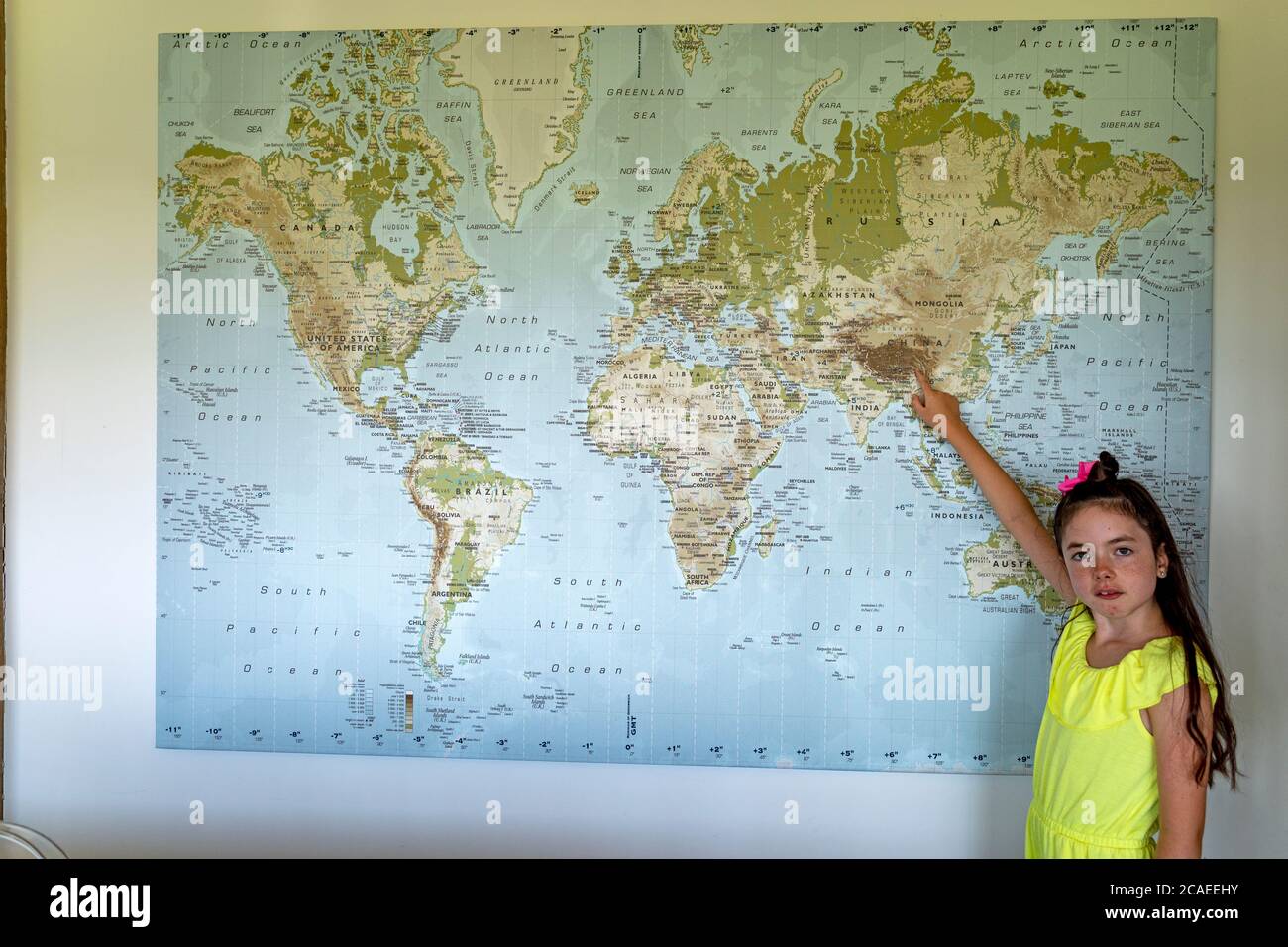 Child pointing to china on a world map hi-res stock photography and ...