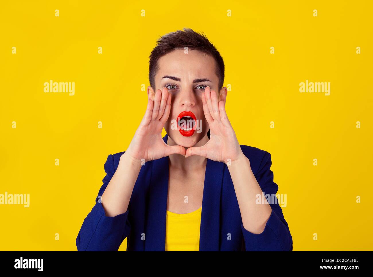 Closeup head shot portrait woman screaming loud isolated on yellow ...
