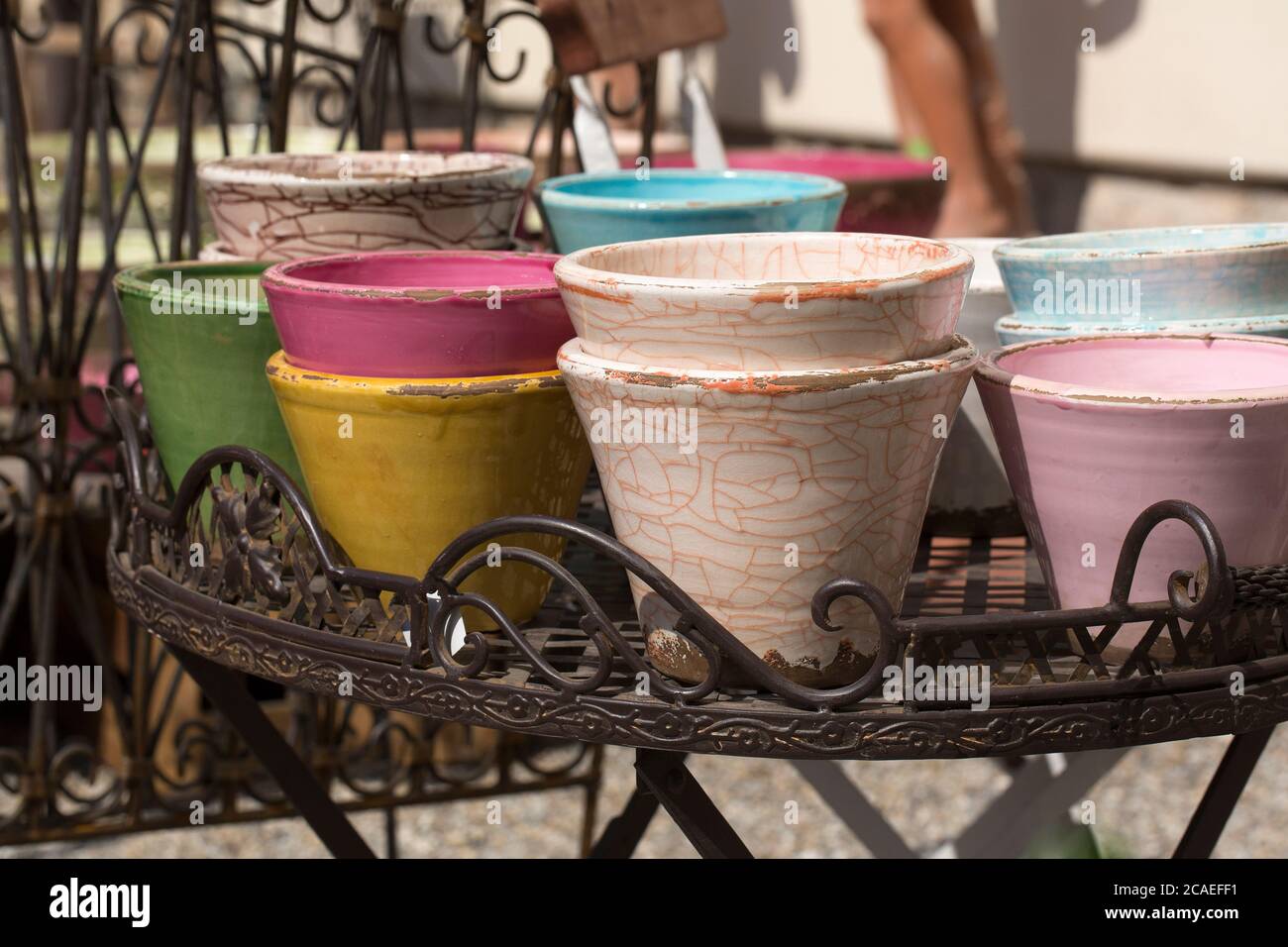 Rustic retro ceramic flower pots in various colors Stock Photo - Alamy