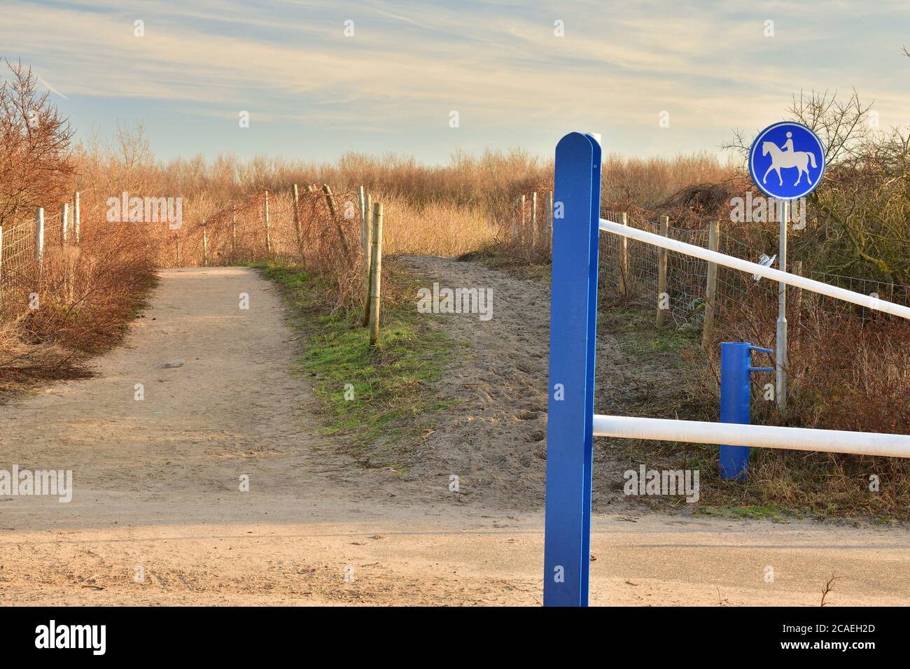 Horse path sign next to the barrier. Afternoon Stock Photo - Alamy