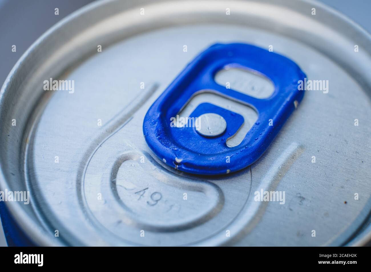 Closed aluminium soda can with blue opener, macro of lid Stock Photo ...