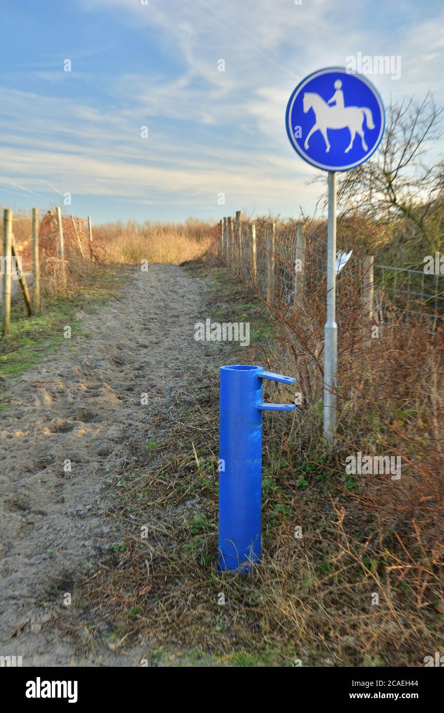 Horse path sign next to the barrier. Afternoon Stock Photo - Alamy