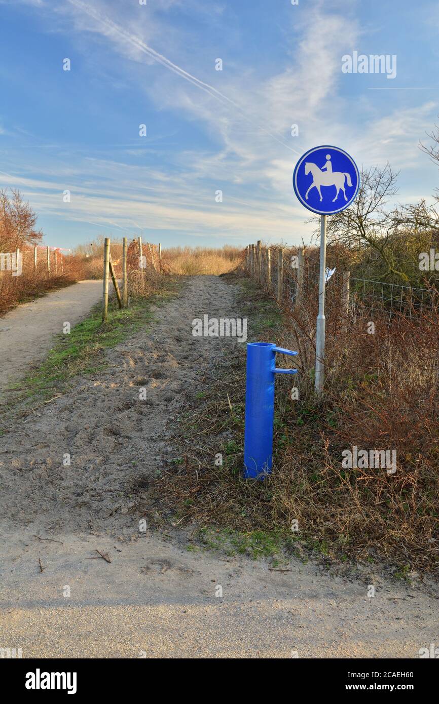 Horse path sign next to the barrier. Afternoon Stock Photo - Alamy