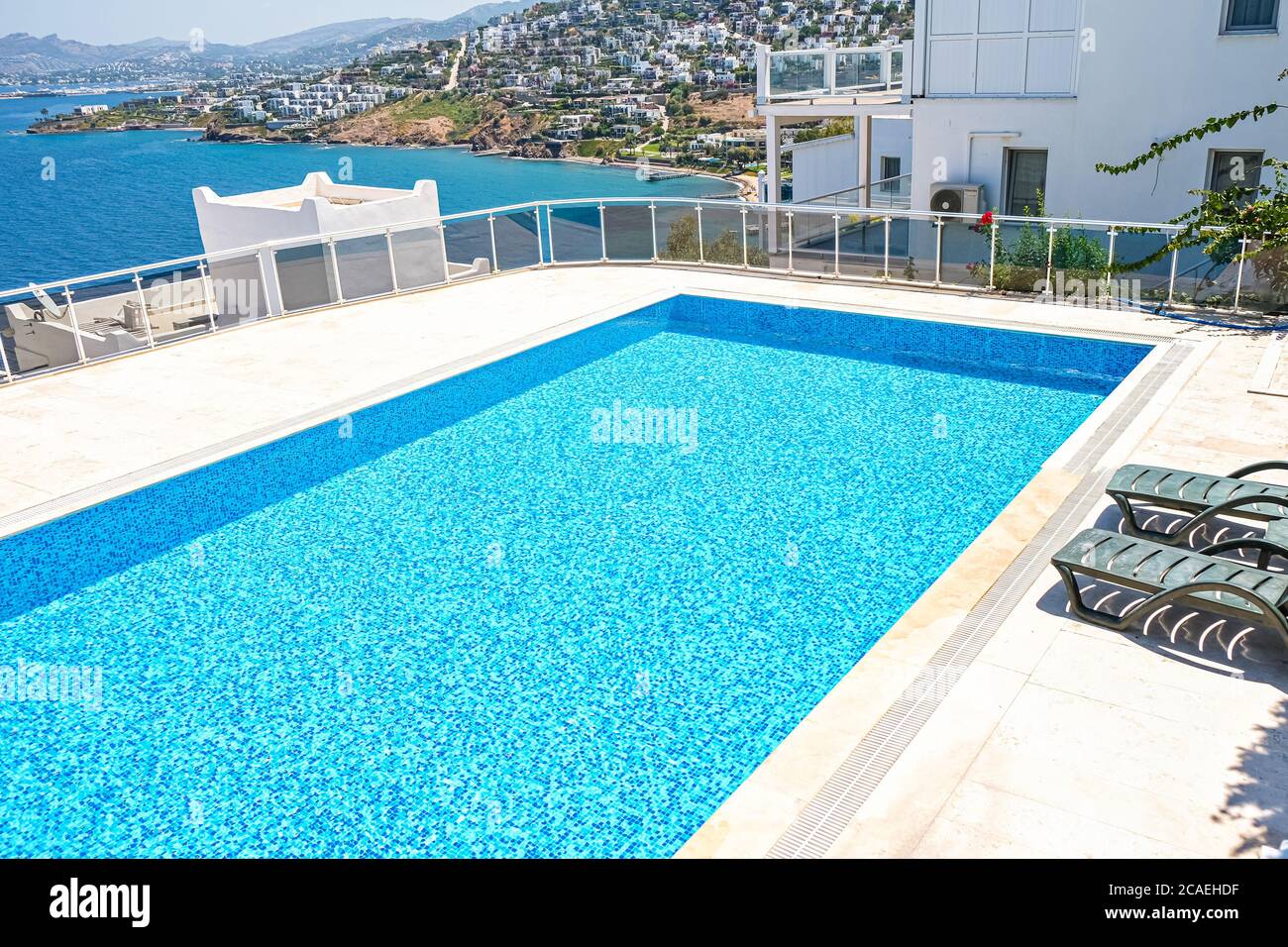 Swimming pool with turquoise color water at hotel or holiday village ...
