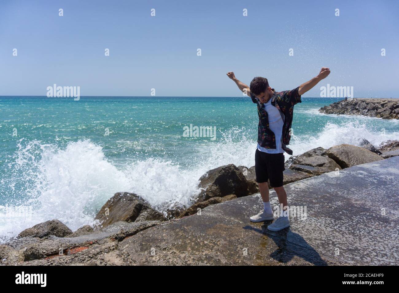 Man expressing happiness on beach hi-res stock photography and images ...