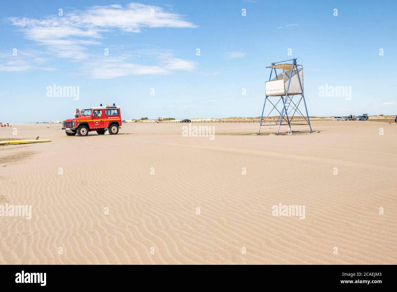 red life guard Land Rover defender on patrol on the beach (Plage ...