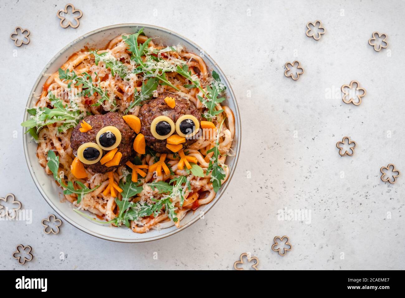 Pasta spaghetti with funny birds meatballs for kids Stock Photo - Alamy