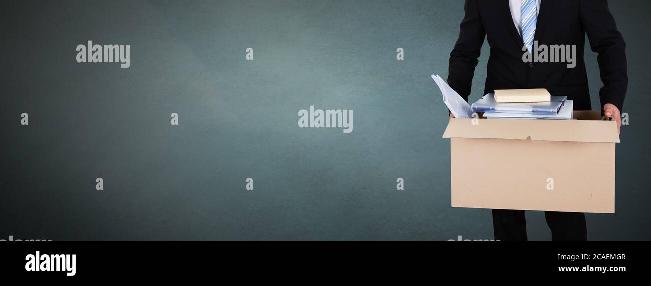 Fired Employee Carrying Moving Box. Unemployed Man Standing Stock Photo ...