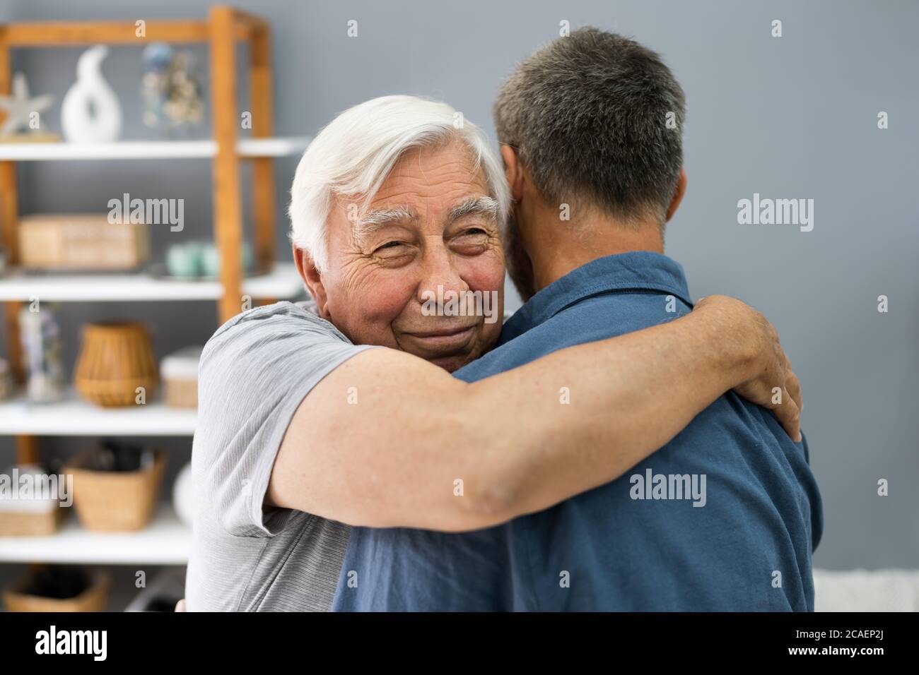 Dad hugging son hi-res stock photography and images - Alamy