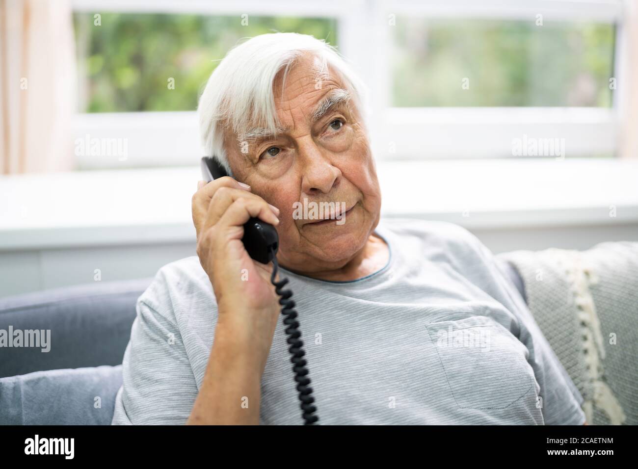 Senior Old Man Talking On Landline Telephone Stock Photo - Alamy