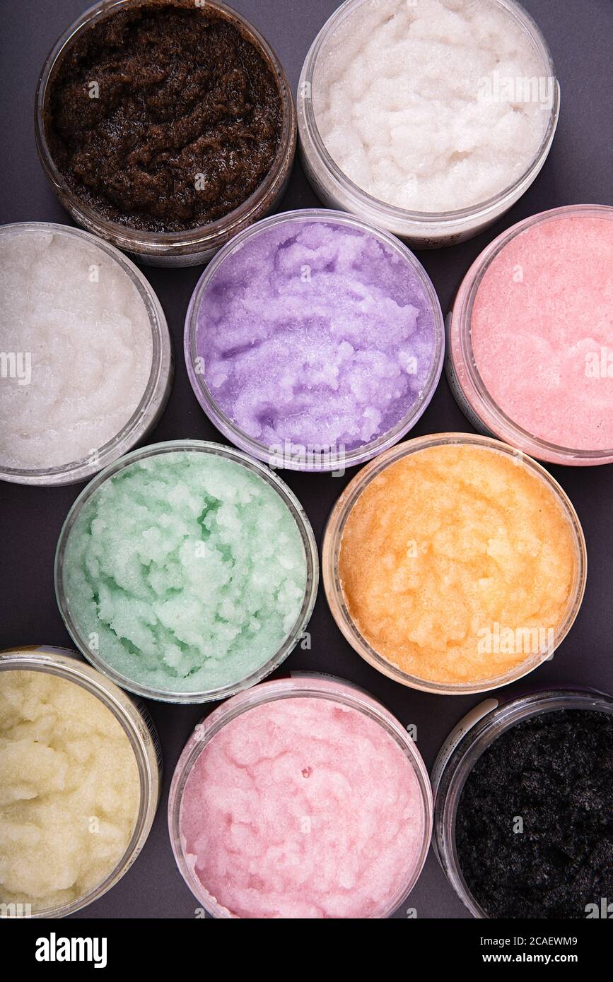 ten cans of colored substance, round containers with colored cosmetics ...