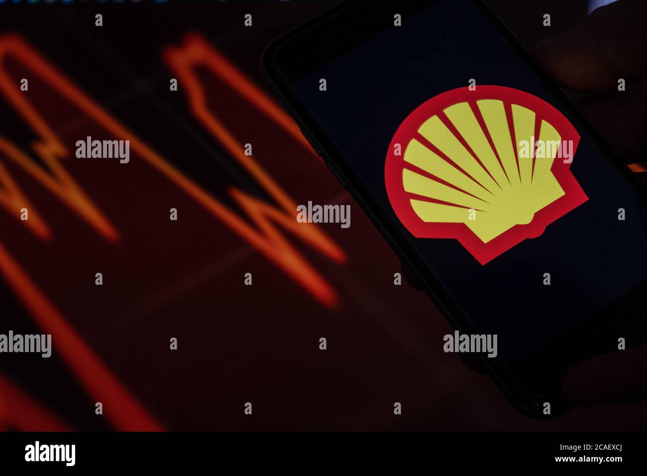In this photo illustration a Royal Dutch Shell logo is seen displayed ...
