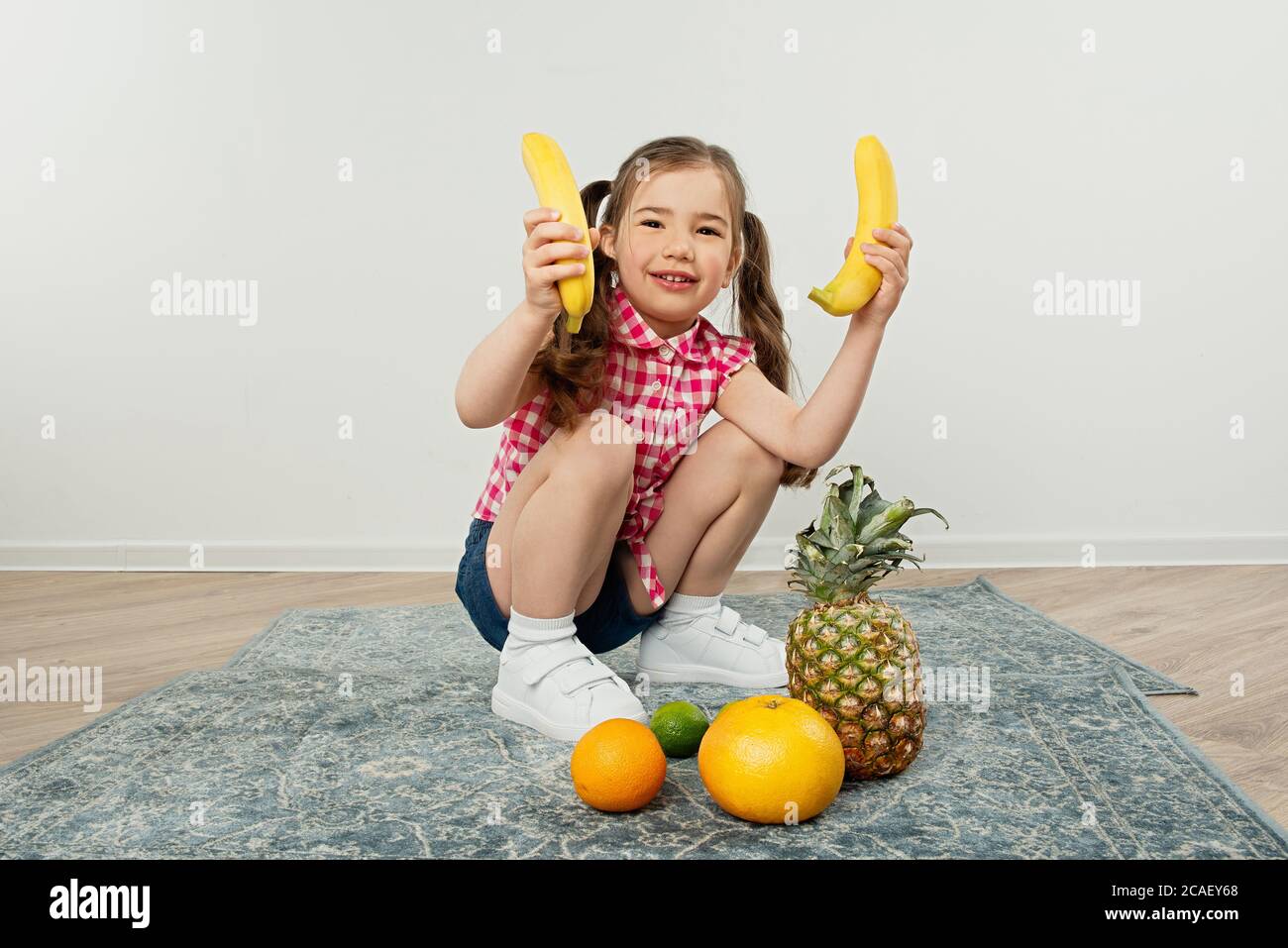 Girl with bananas hi-res stock photography and images - Alamy