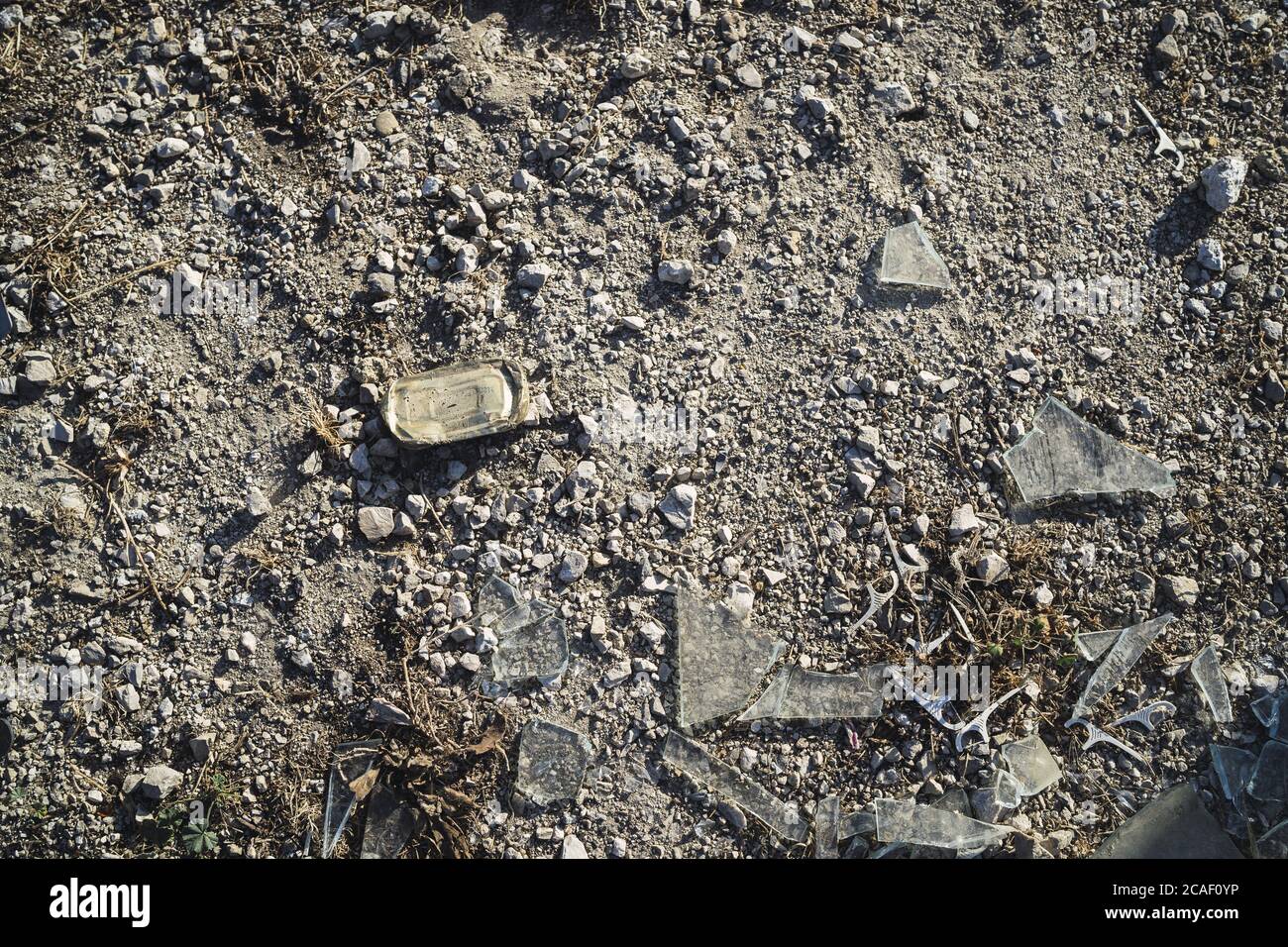 Top view of broken pieces of glass on the ground Stock Photo - Alamy