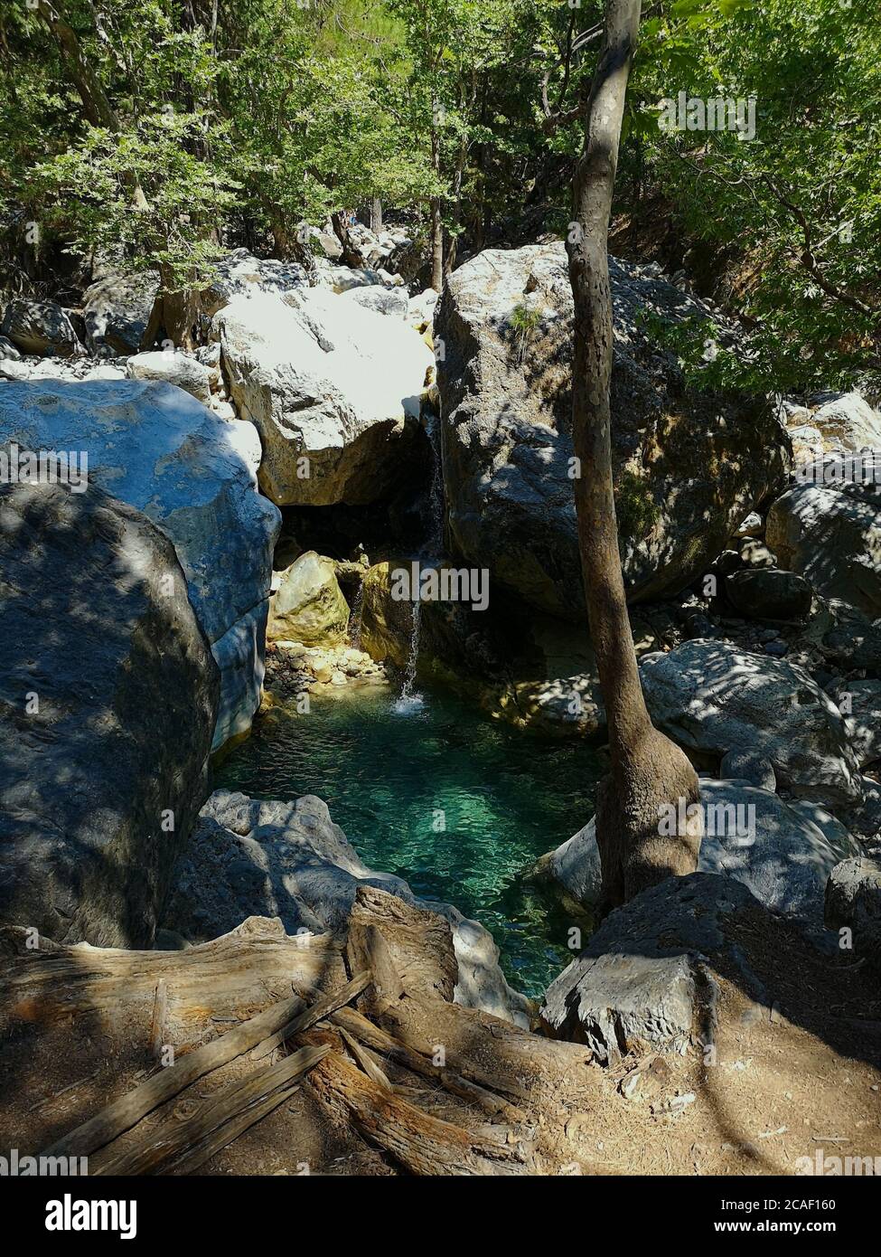A charming crystal blue natural pool/lagoon formed by a valley river in ...