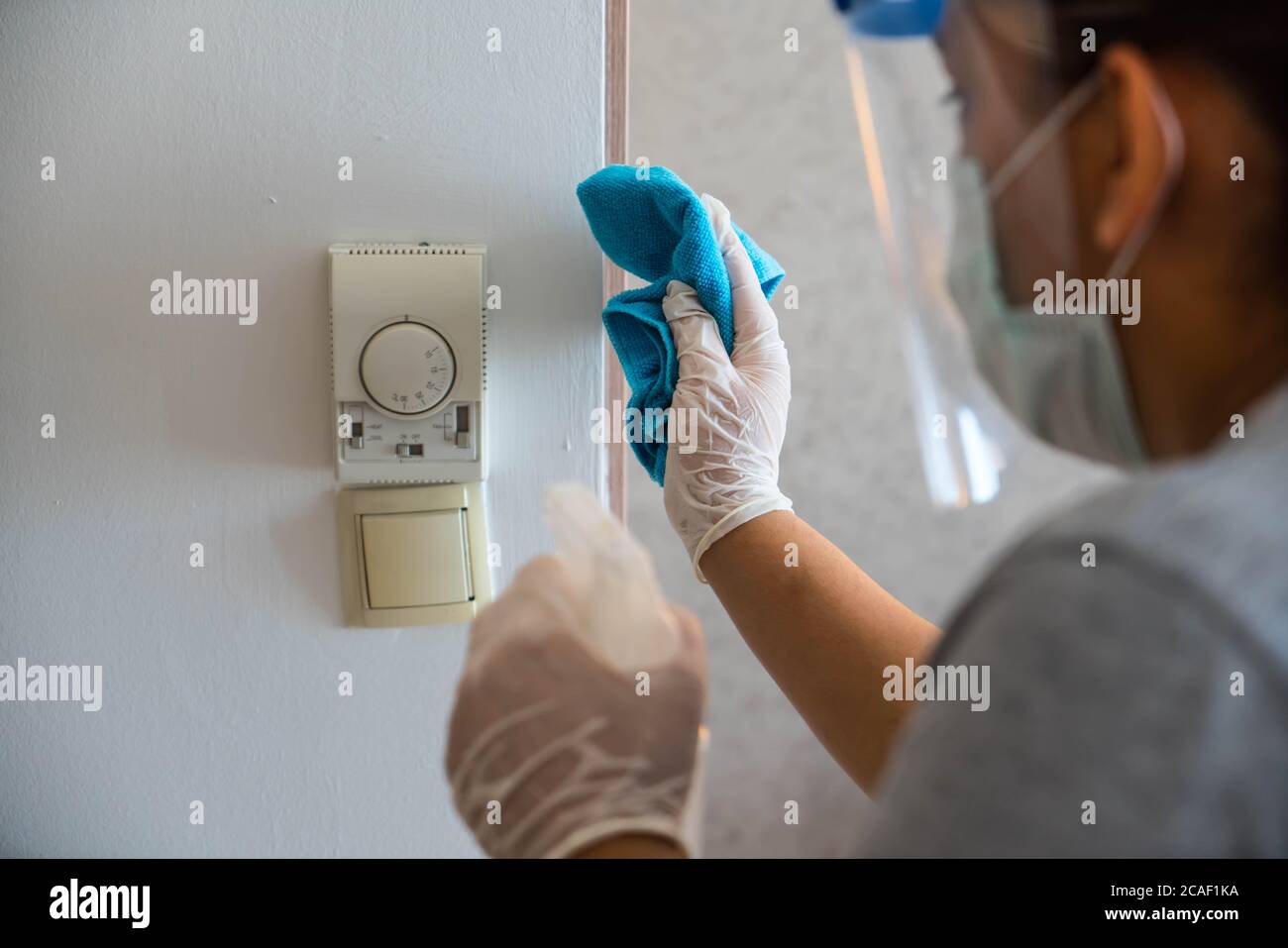 Cleaning in hotel or hospital. Hands in gloves cleaning and ...